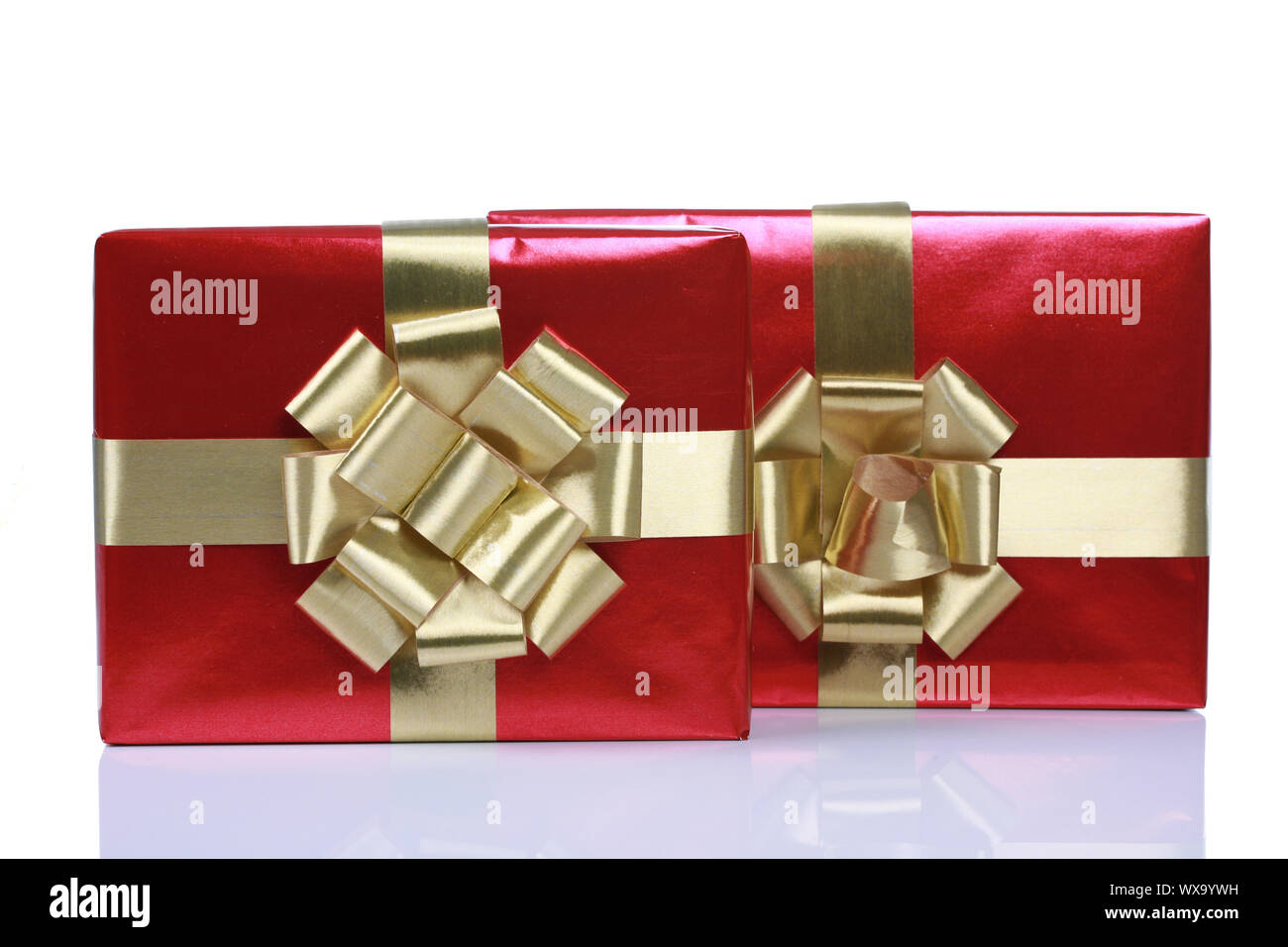 Elegant red presents with gold ribbons isolated on white Stock Photo ...