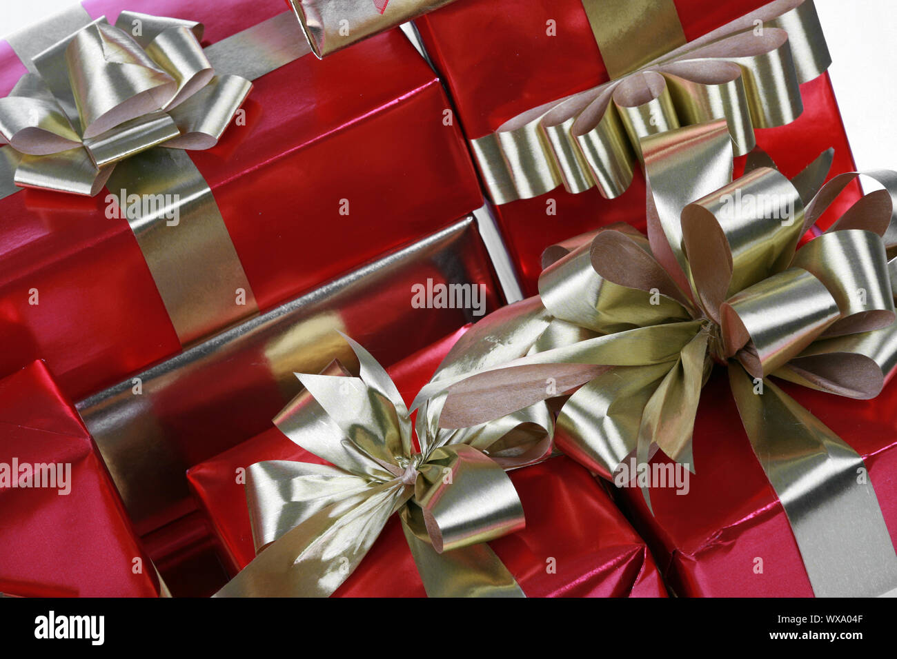 Elegant red presents with gold ribbons isolated on white Stock Photo ...