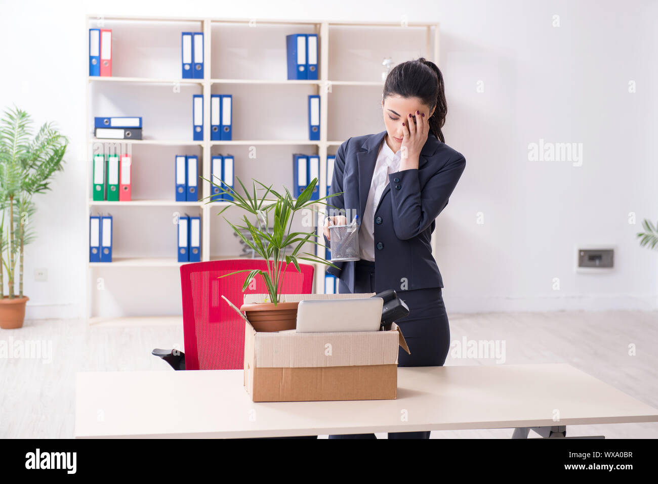 Young female employee being fired from her work Stock Photo - Alamy