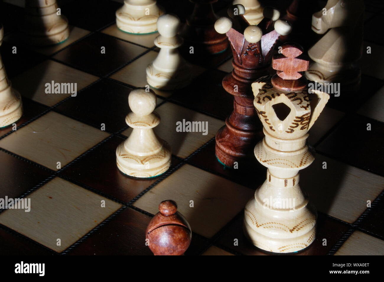 chess pieces on chess board showing power and success Stock Photo - Alamy