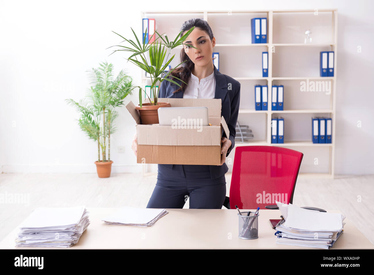 Young female employee being fired from her work Stock Photo - Alamy