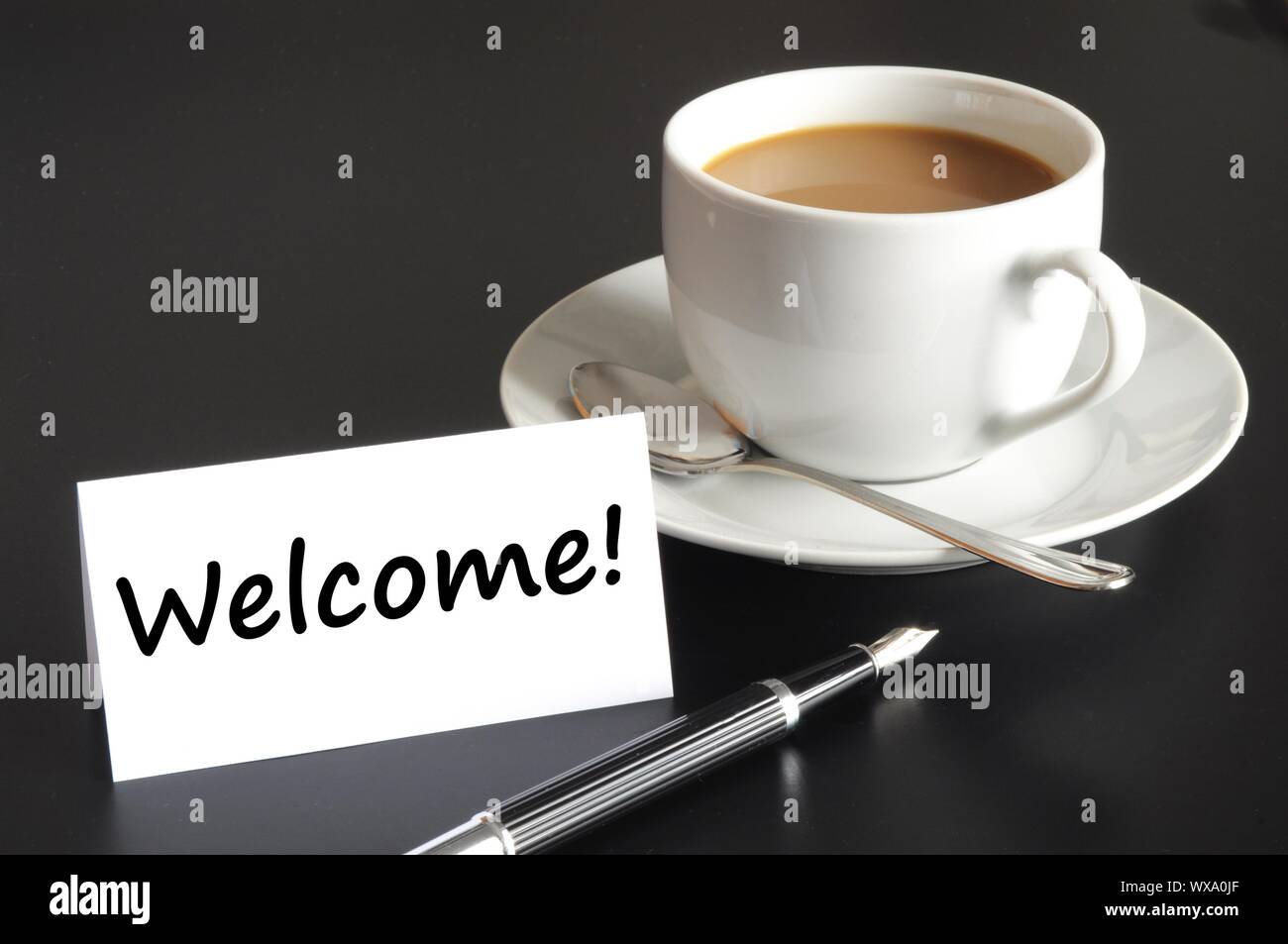 welcome concept with cup of coffee and text message on black Stock ...