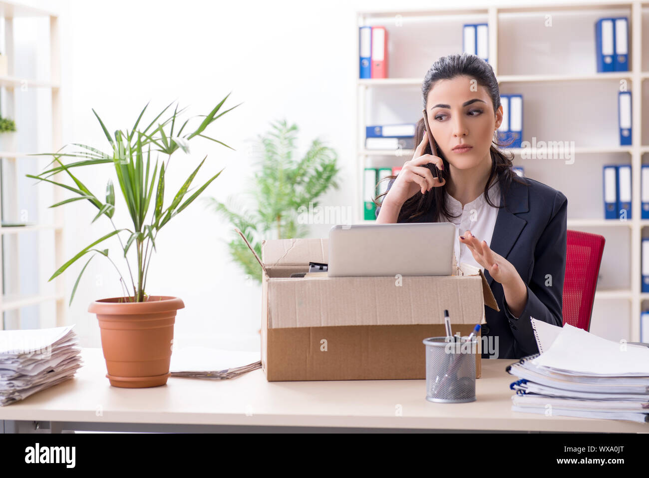 Young female employee being fired from her work Stock Photo - Alamy