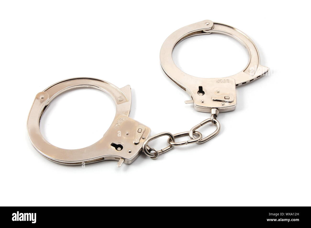 police handcuffs isolated on a white background Stock Photo - Alamy