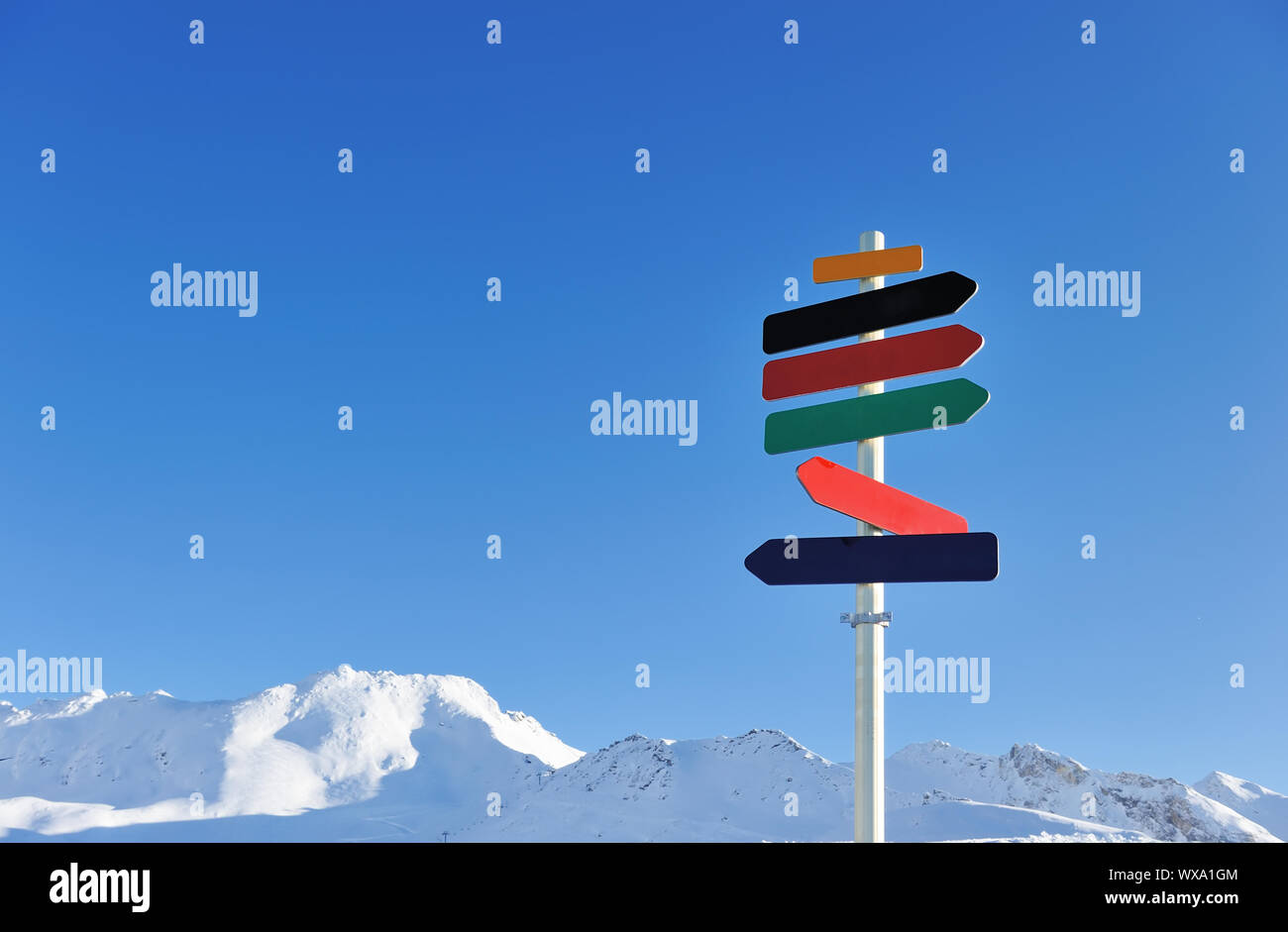 Arrow sign at mountains with snow in winter, Val-d'Isere, Alps, France ...