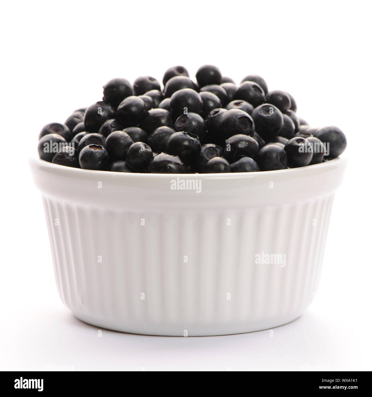 Blueberry in bowl isolated on white Stock Photo - Alamy
