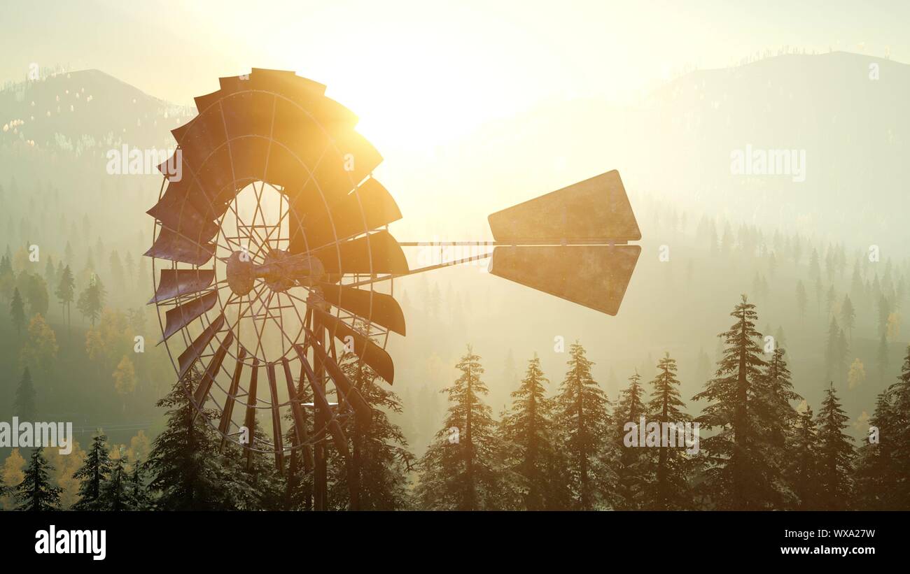Typical Old Windmill turbine in forest at sunset Stock Photo - Alamy