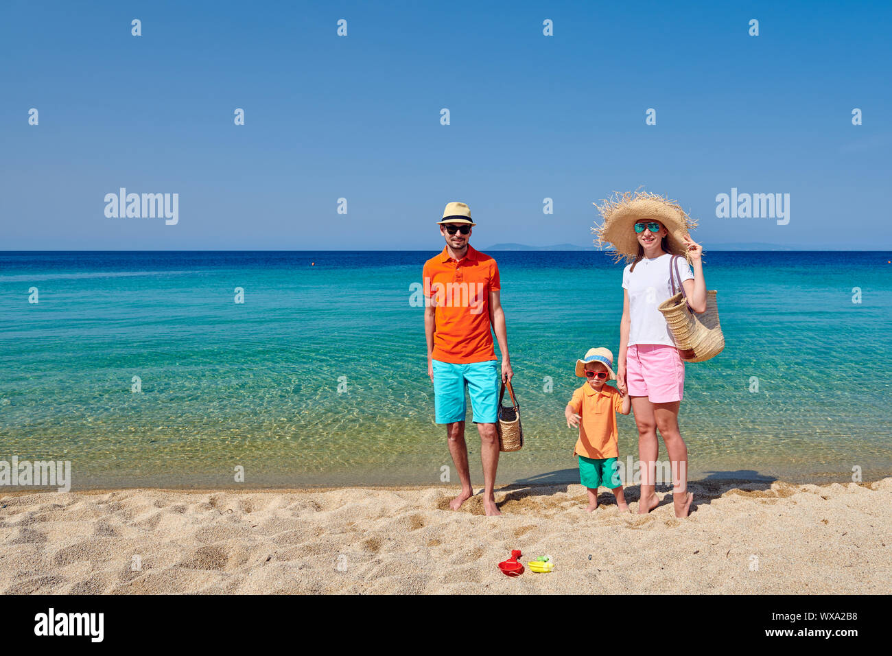Family on beach in Greece Stock Photo - Alamy