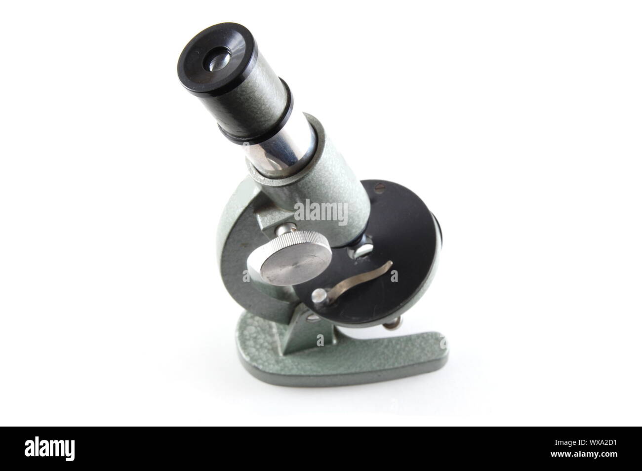 Old microscope isolated on a white background Stock Photo - Alamy