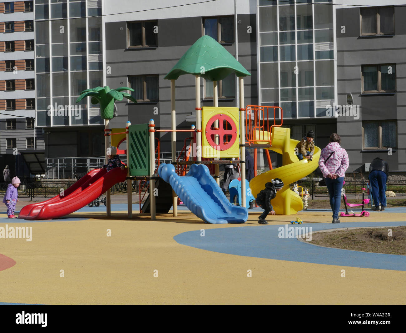buildings with a children's playground Stock Photo - Alamy