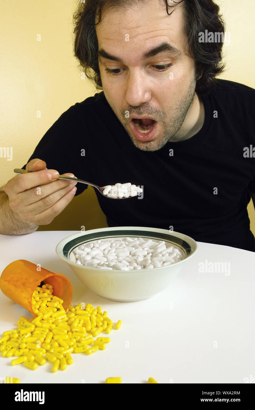 A man feeding himself medication with a spoon. Metaphor for addiction ...
