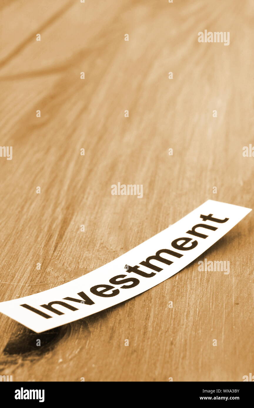 word investment written on paper and space for text message Stock Photo ...