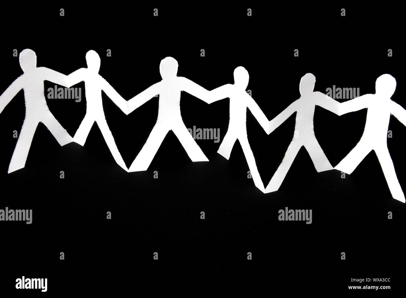 team of paper people having a party Stock Photo - Alamy