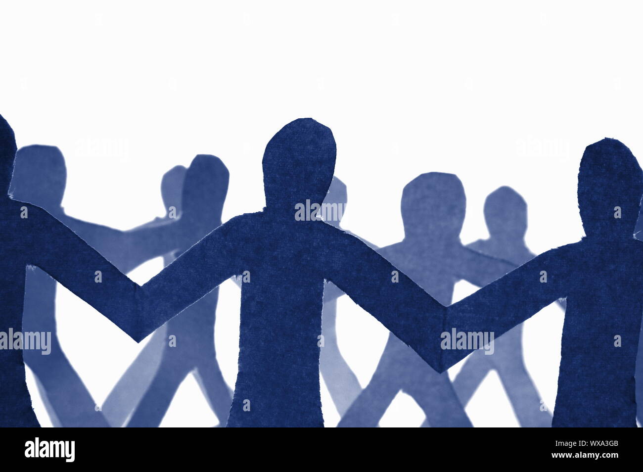 paper people doing teamwork in their business Stock Photo - Alamy