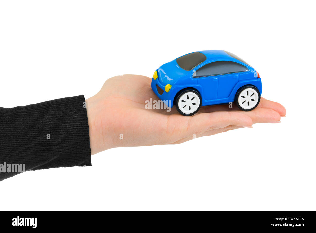 Hand and toy car Stock Photo - Alamy