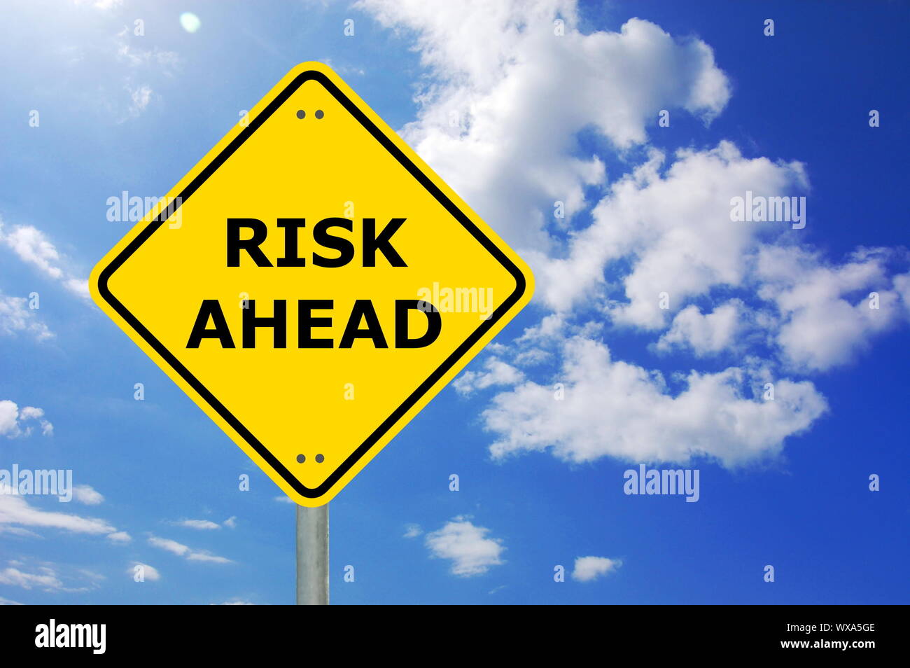 risk management concept with yellow road sign Stock Photo - Alamy
