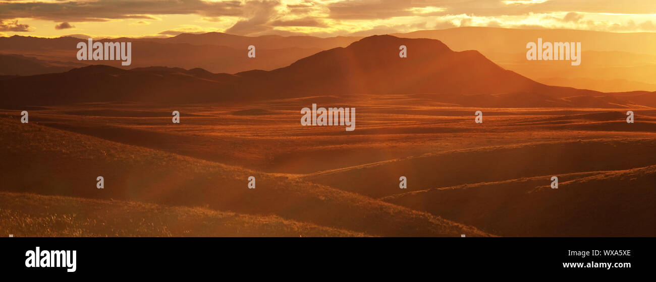 Mountains on sunset Stock Photo - Alamy