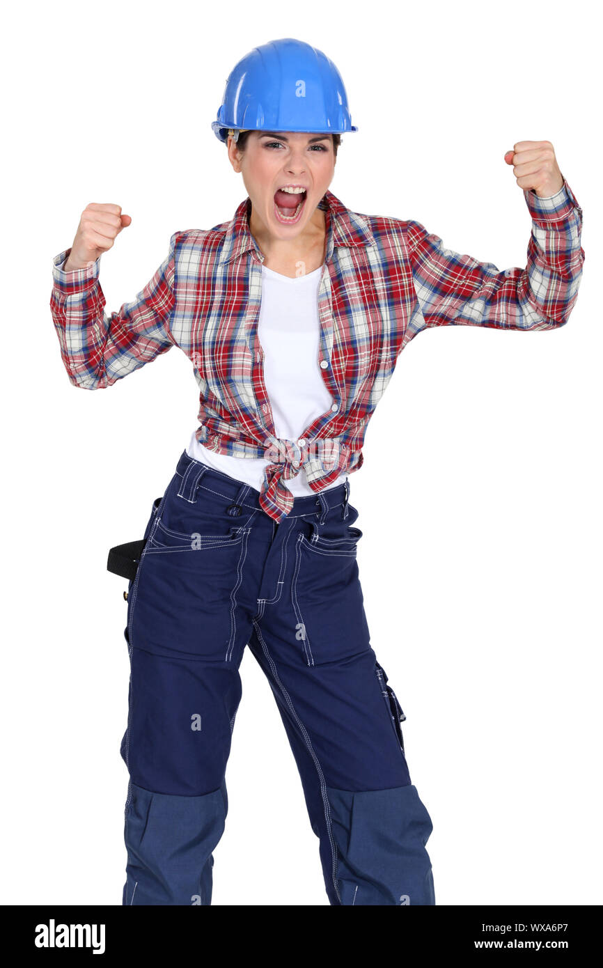 Cheering construction worker Stock Photo - Alamy