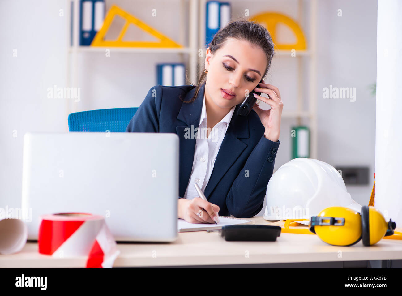 Young female architect working in the office Stock Photo - Alamy