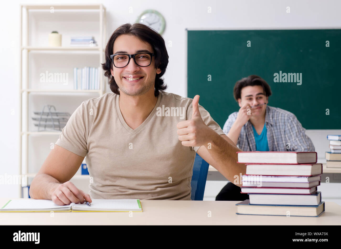 Two male students in the classroom Stock Photo - Alamy