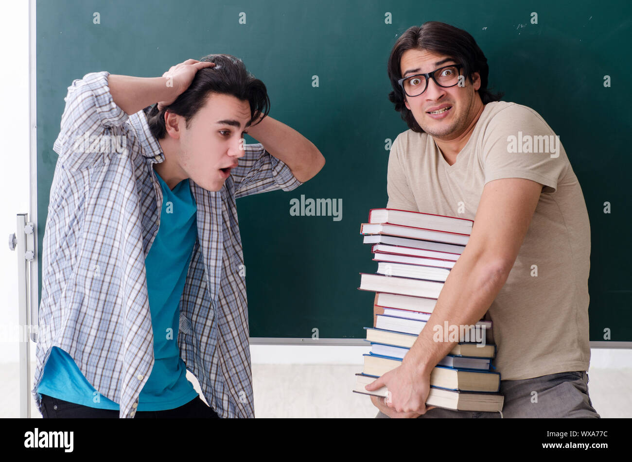 Two male students in the classroom Stock Photo - Alamy