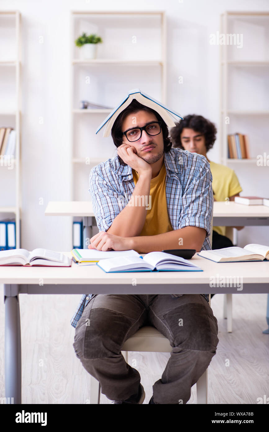 Two male students in the classroom Stock Photo - Alamy