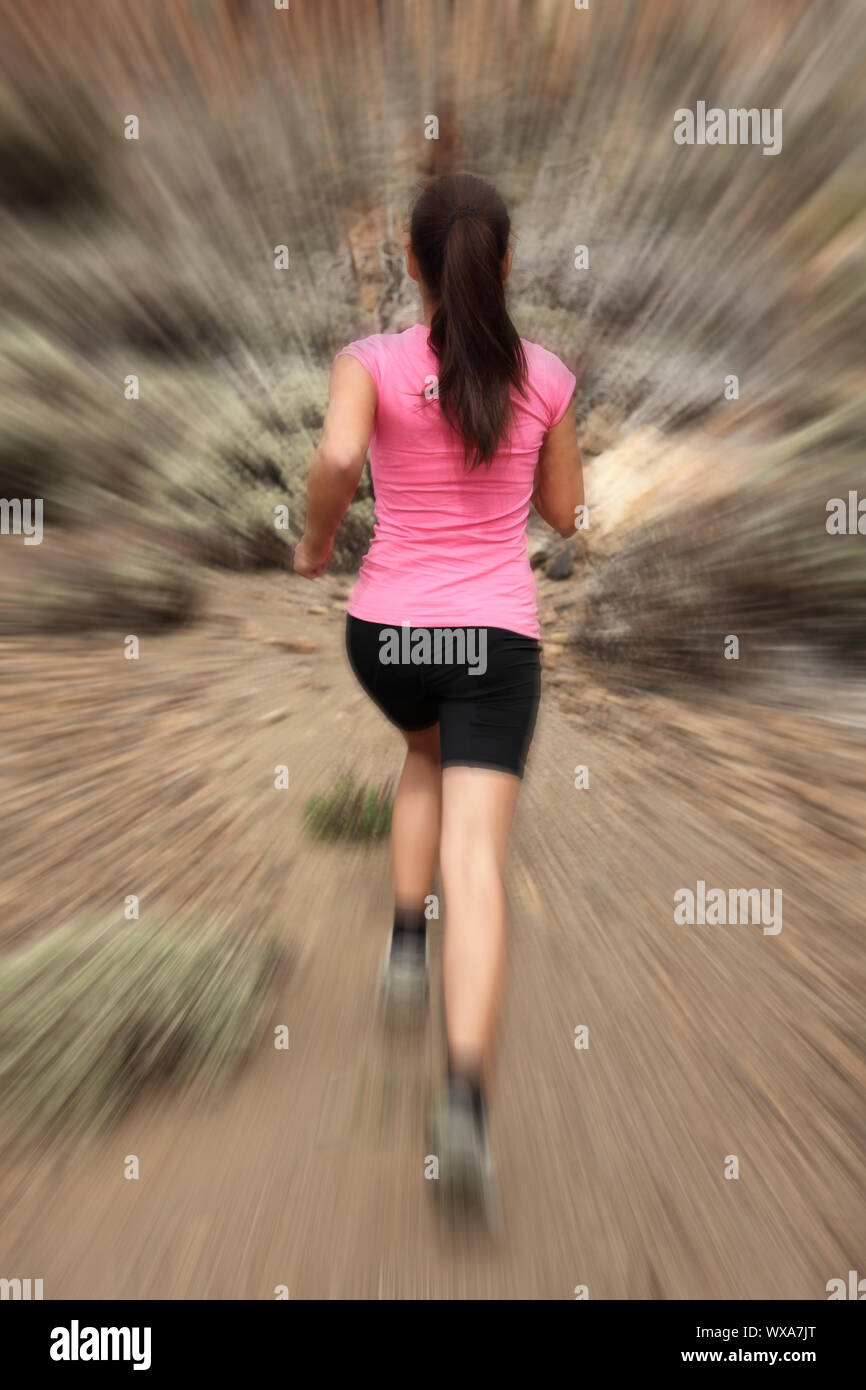 Running - woman runner in motion zoom blur for speed effect. Female ...