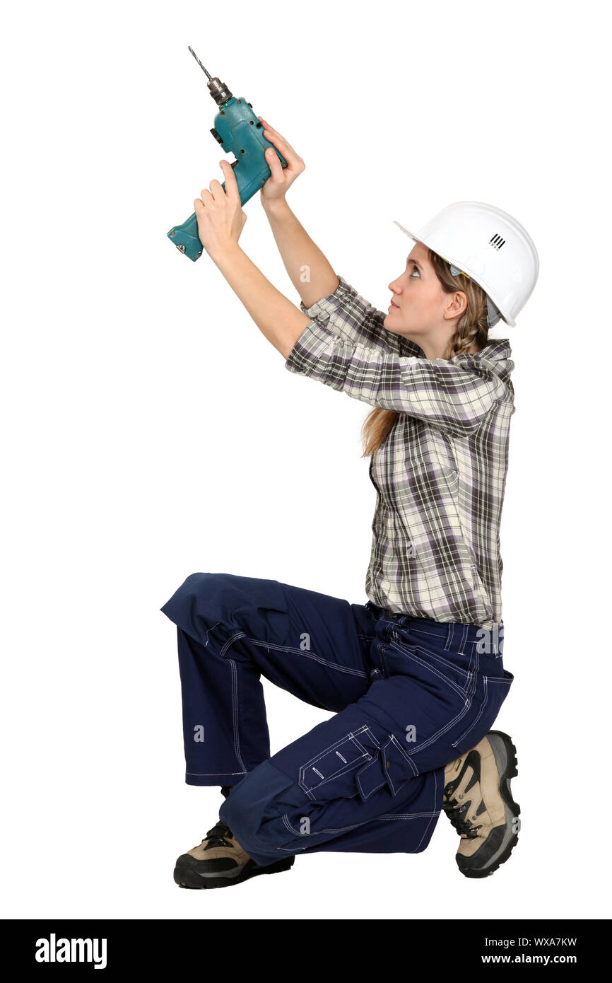 A female handyman with a drill Stock Photo - Alamy