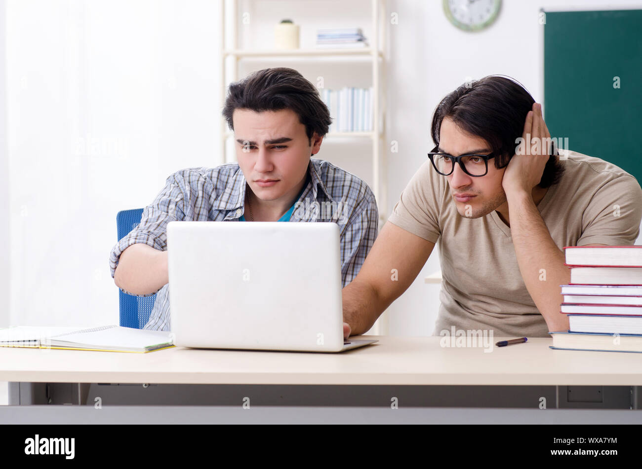 Two male students in the classroom Stock Photo - Alamy