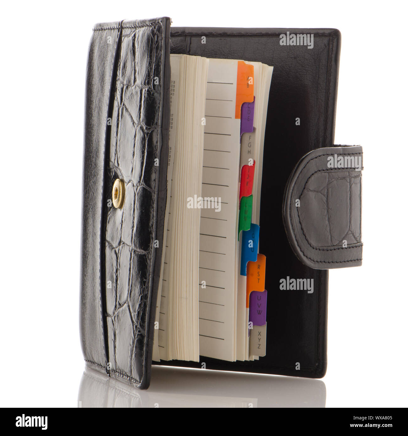 Leather notebook on white reflective background Stock Photo - Alamy