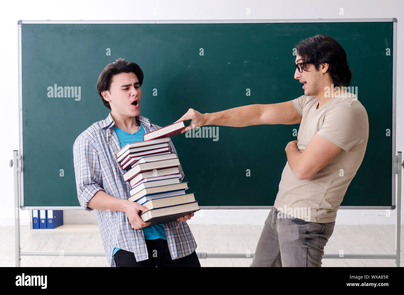 Two male students in the classroom Stock Photo - Alamy