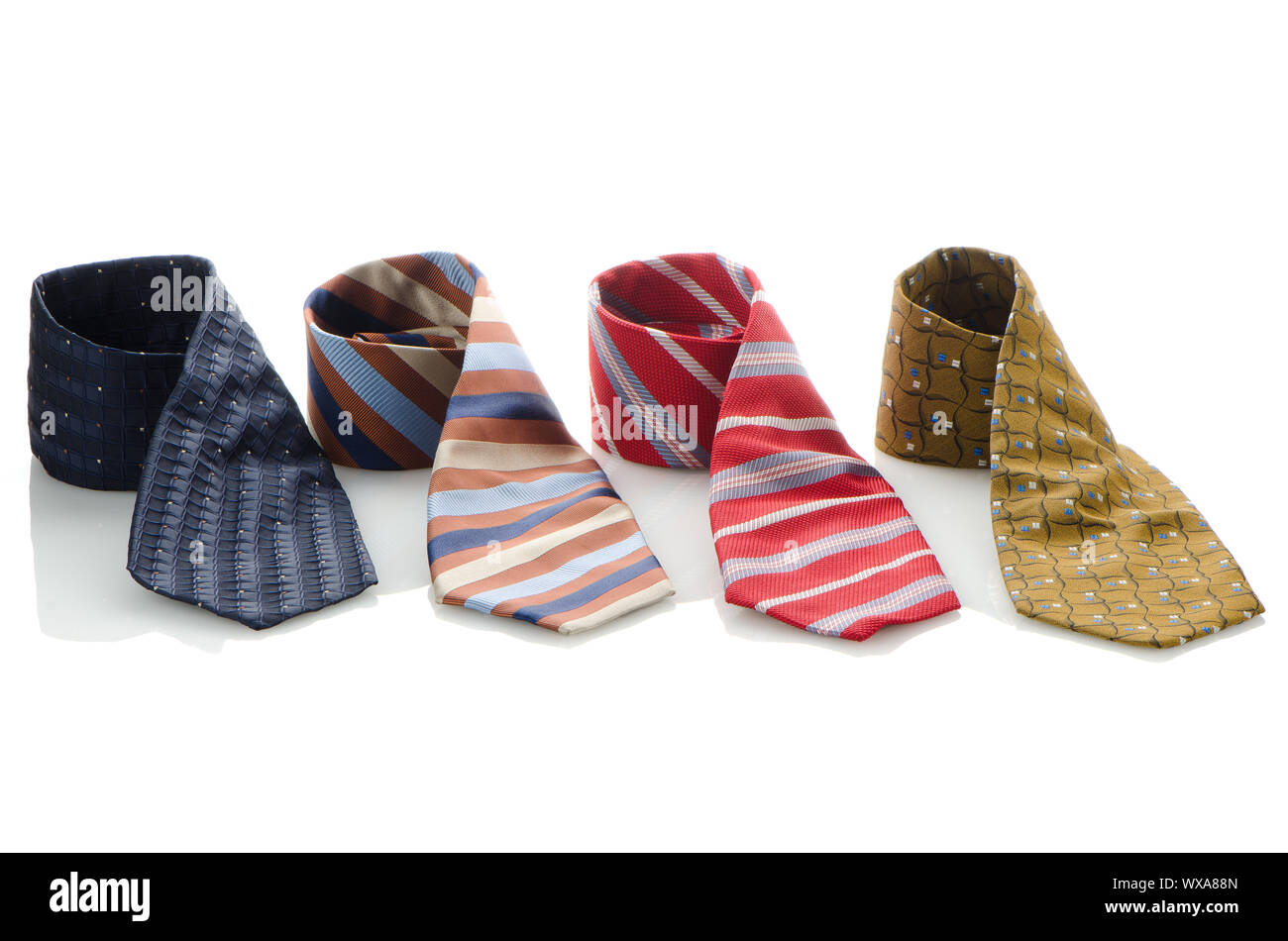 Closeup of four ties isolated on white background Stock Photo - Alamy