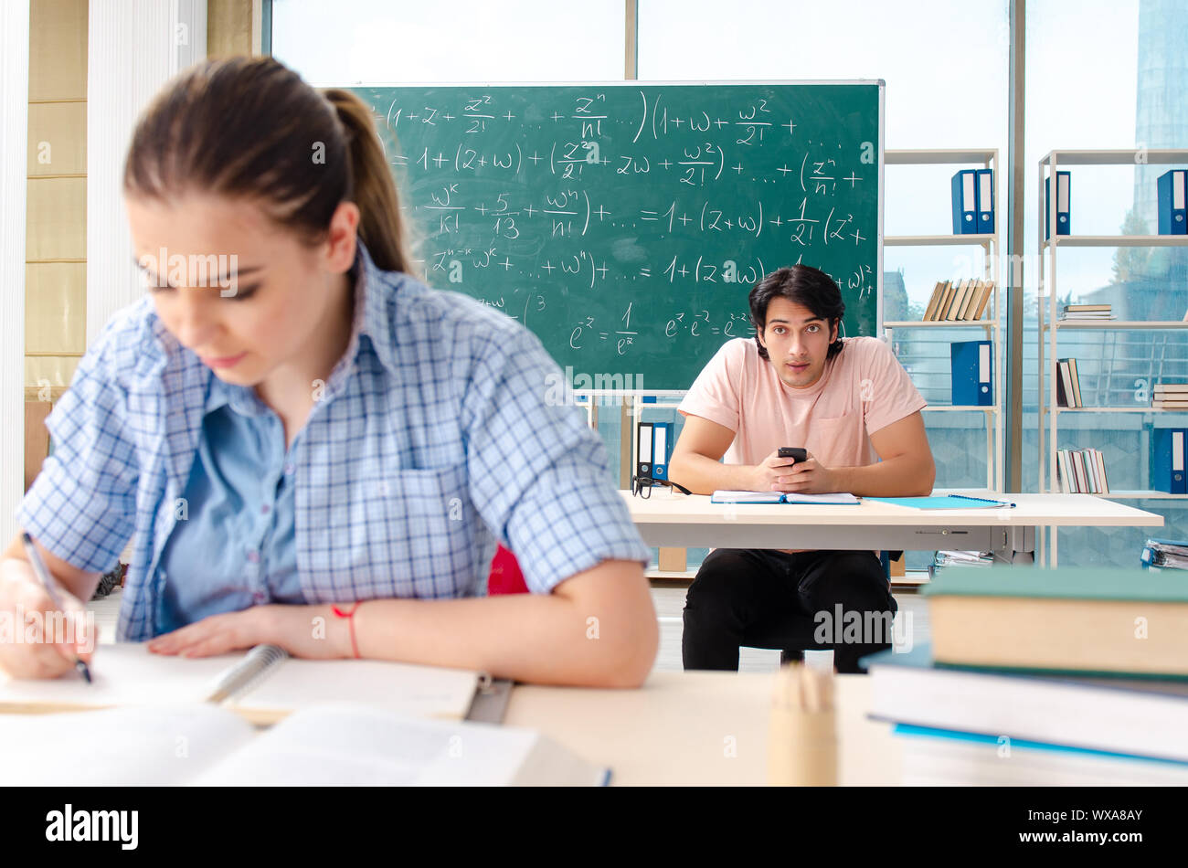 Young students taking the math exam in classroom Stock Photo - Alamy