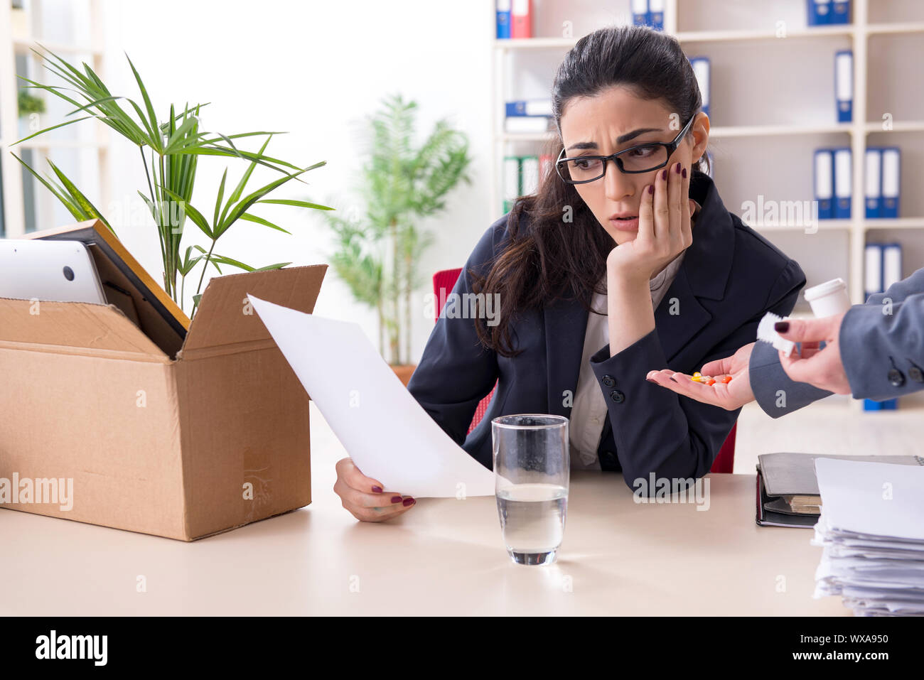 Young female employee being fired from her work Stock Photo - Alamy