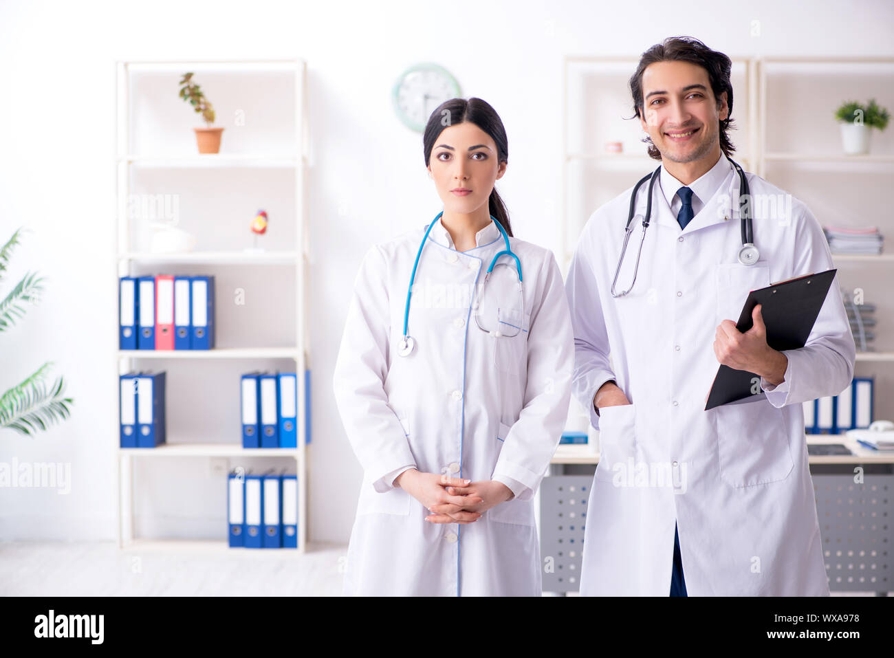 Two young doctors working in the clinic Stock Photo - Alamy