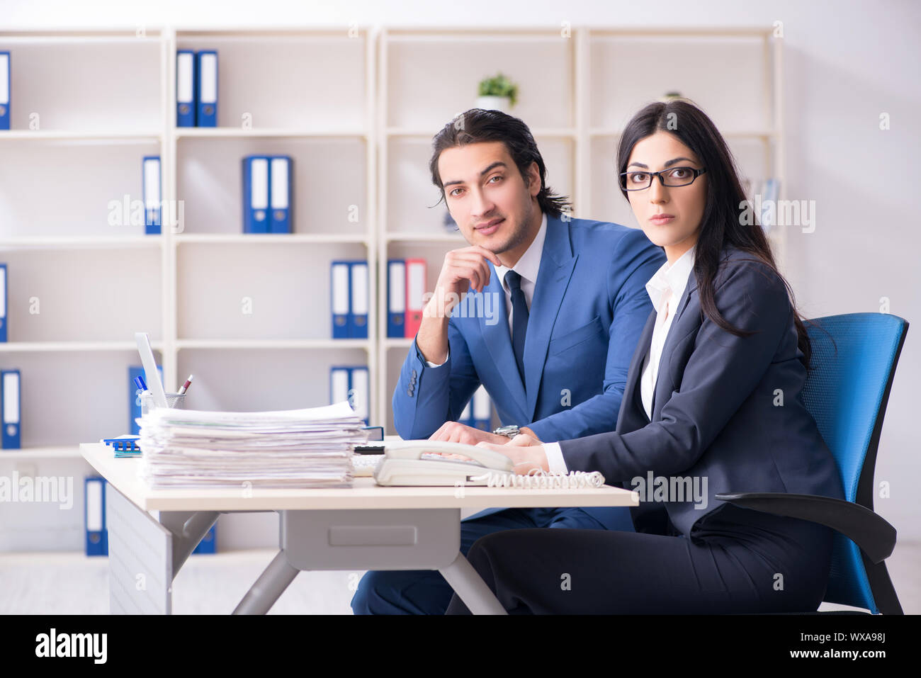 Two employees working in the office Stock Photo - Alamy