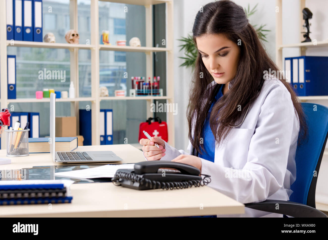 Female doctor working in the clinic Stock Photo - Alamy