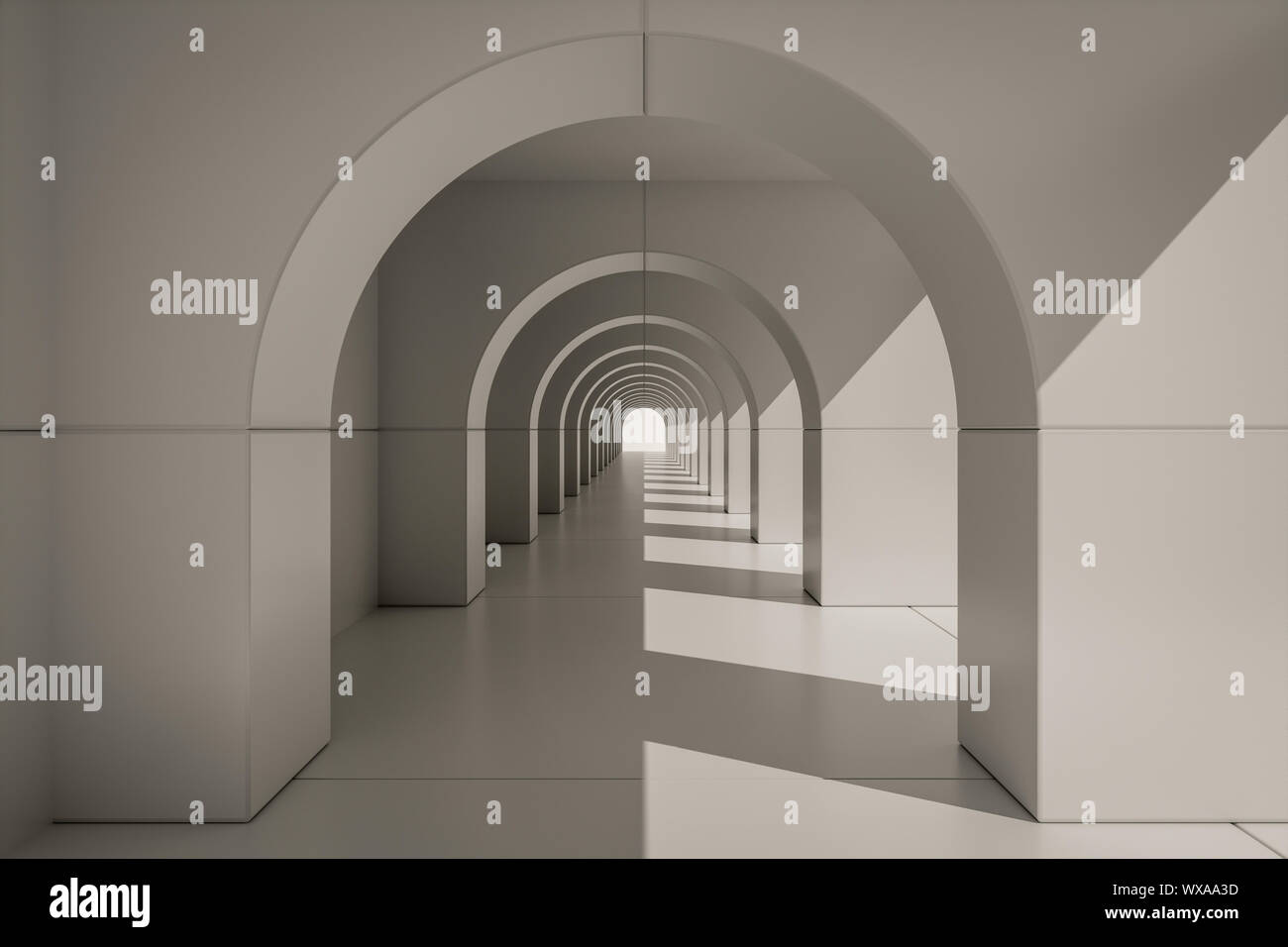 An typical archway centered with light from right Stock Photo - Alamy