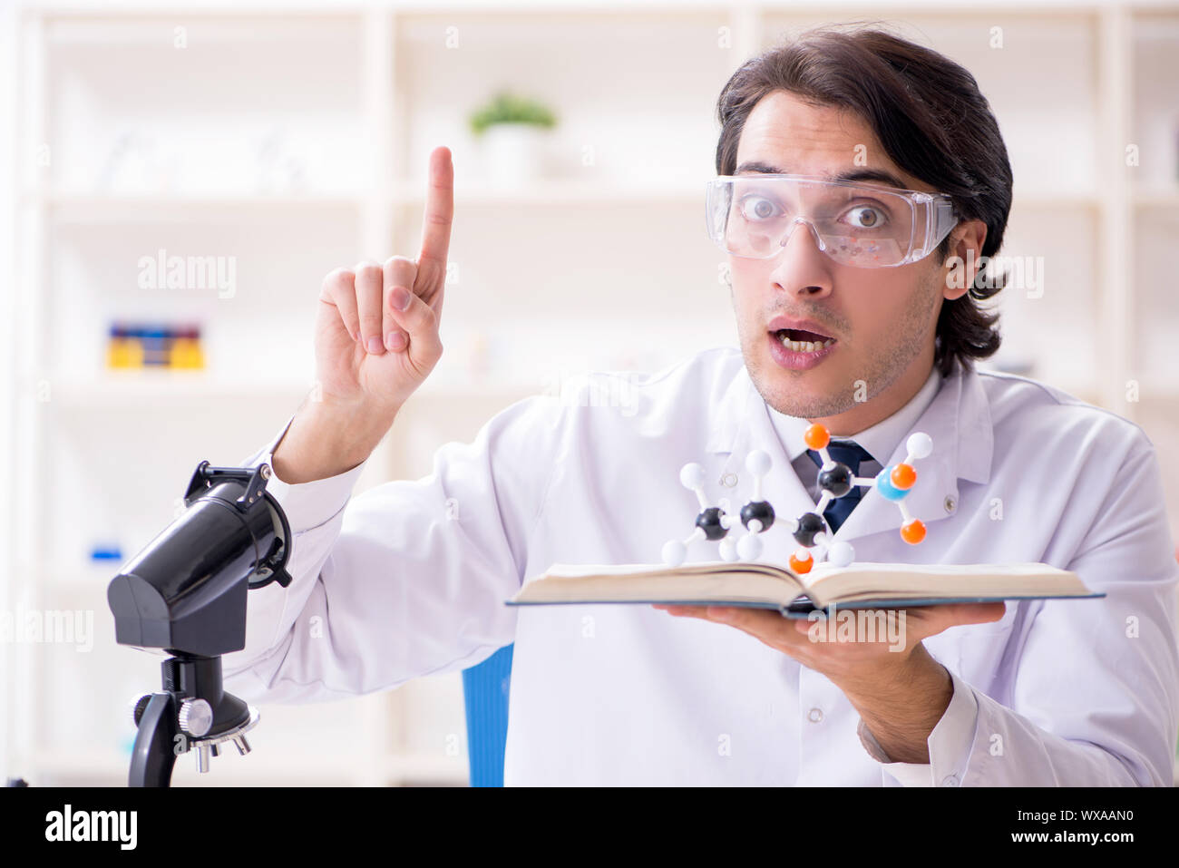 Young male scientist working in the lab Stock Photo - Alamy