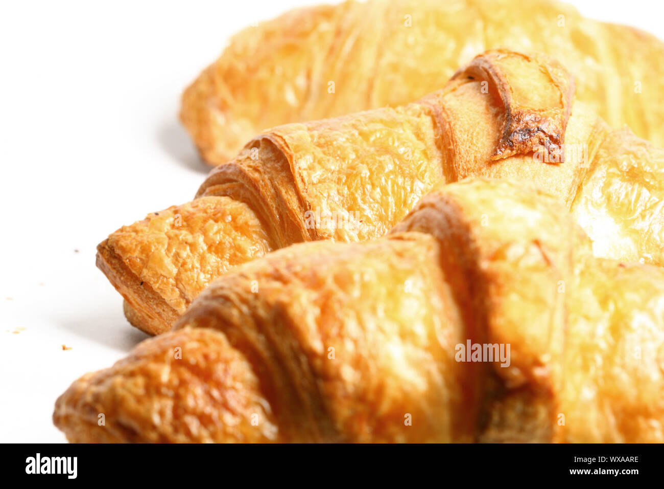 Croissant isolated on white background macro Stock Photo - Alamy