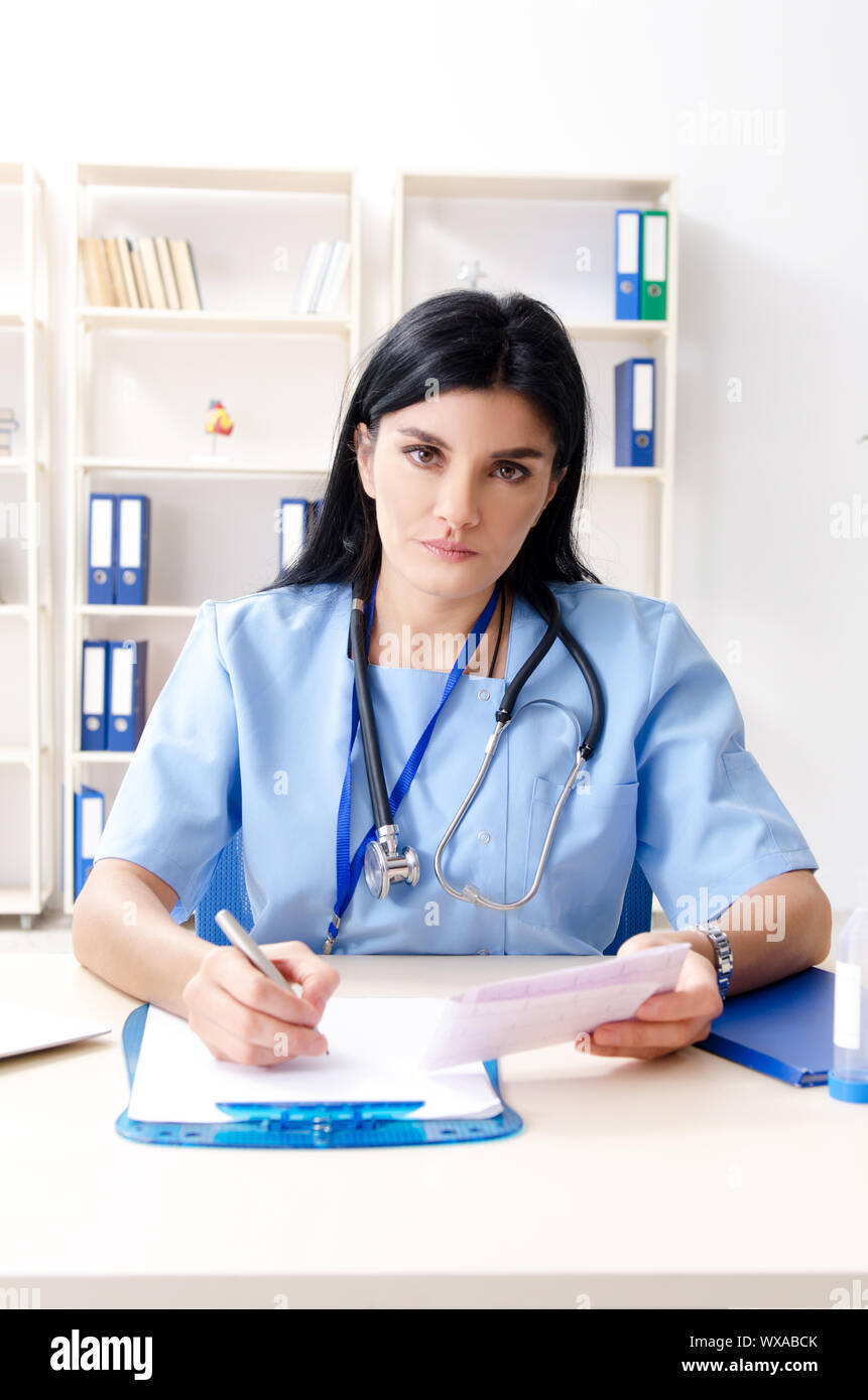 Female doctor cardiologist working in the clinic Stock Photo - Alamy