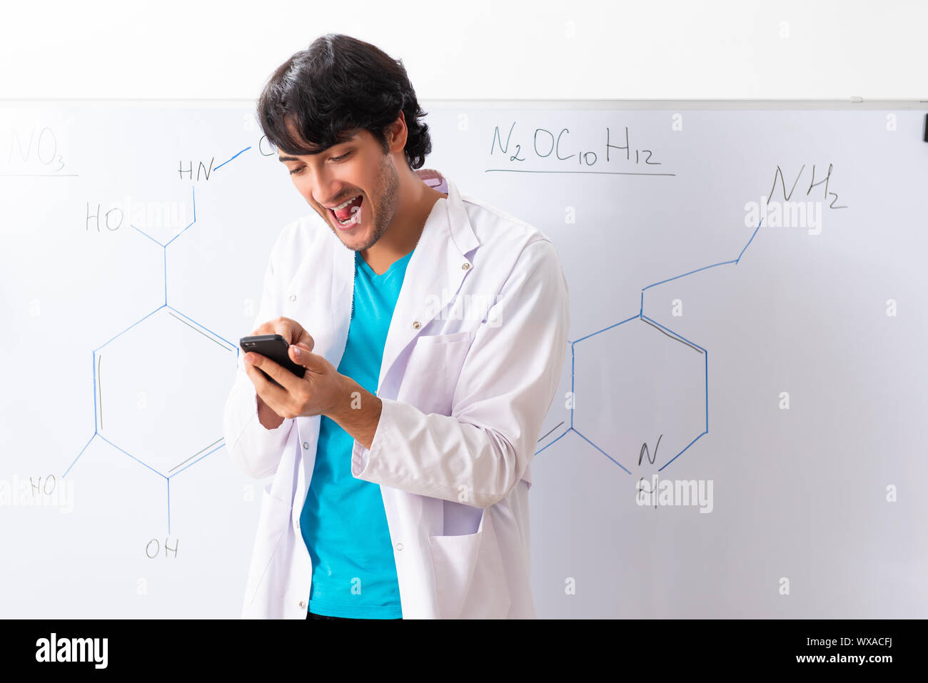 High school student texting in class hi-res stock photography and ...