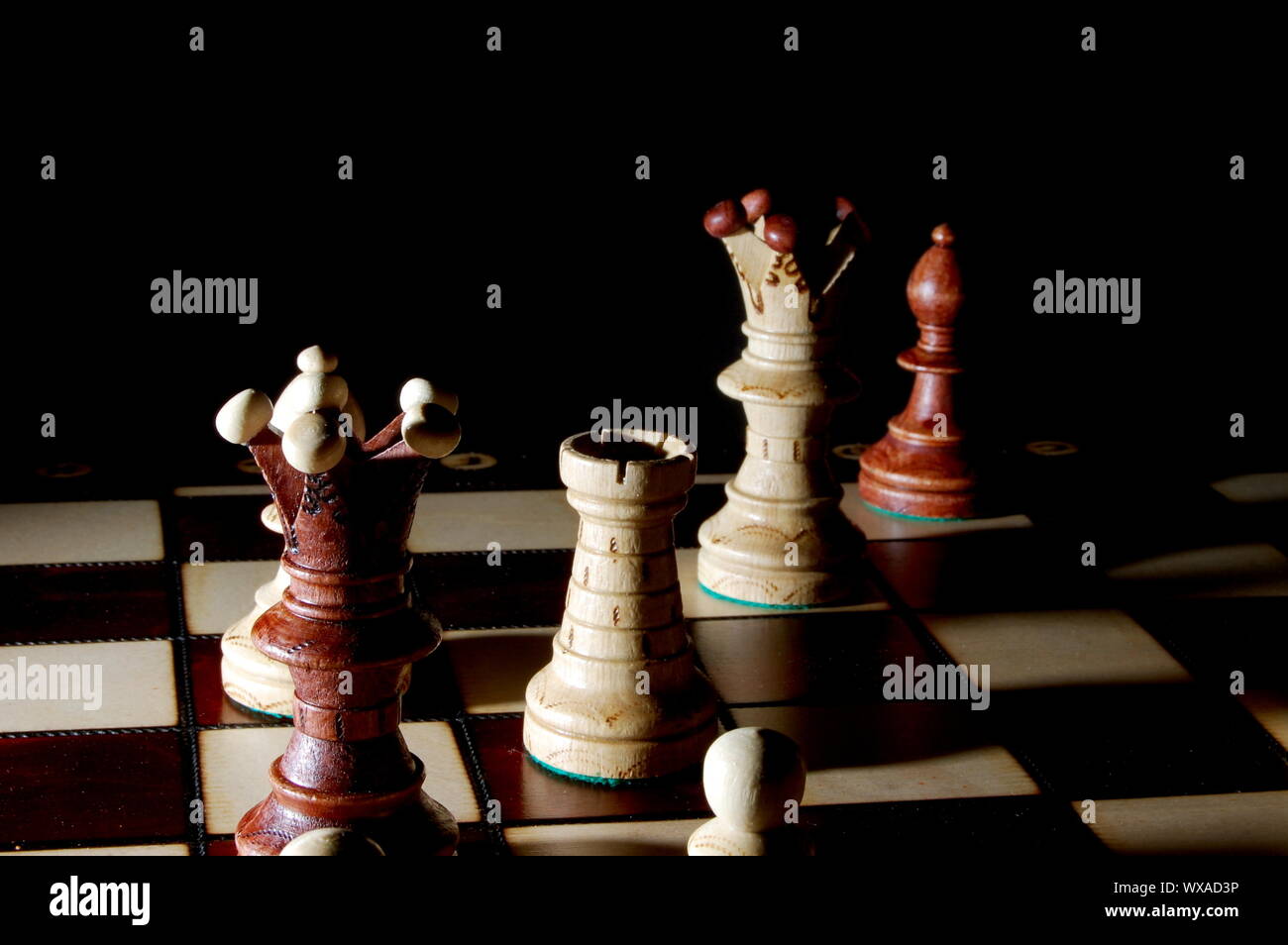 chess pieces on chess board showing power and success Stock Photo - Alamy