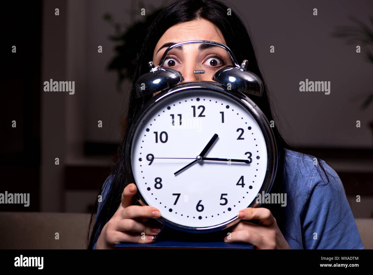 Young female student preparing for exams at night time Stock Photo - Alamy