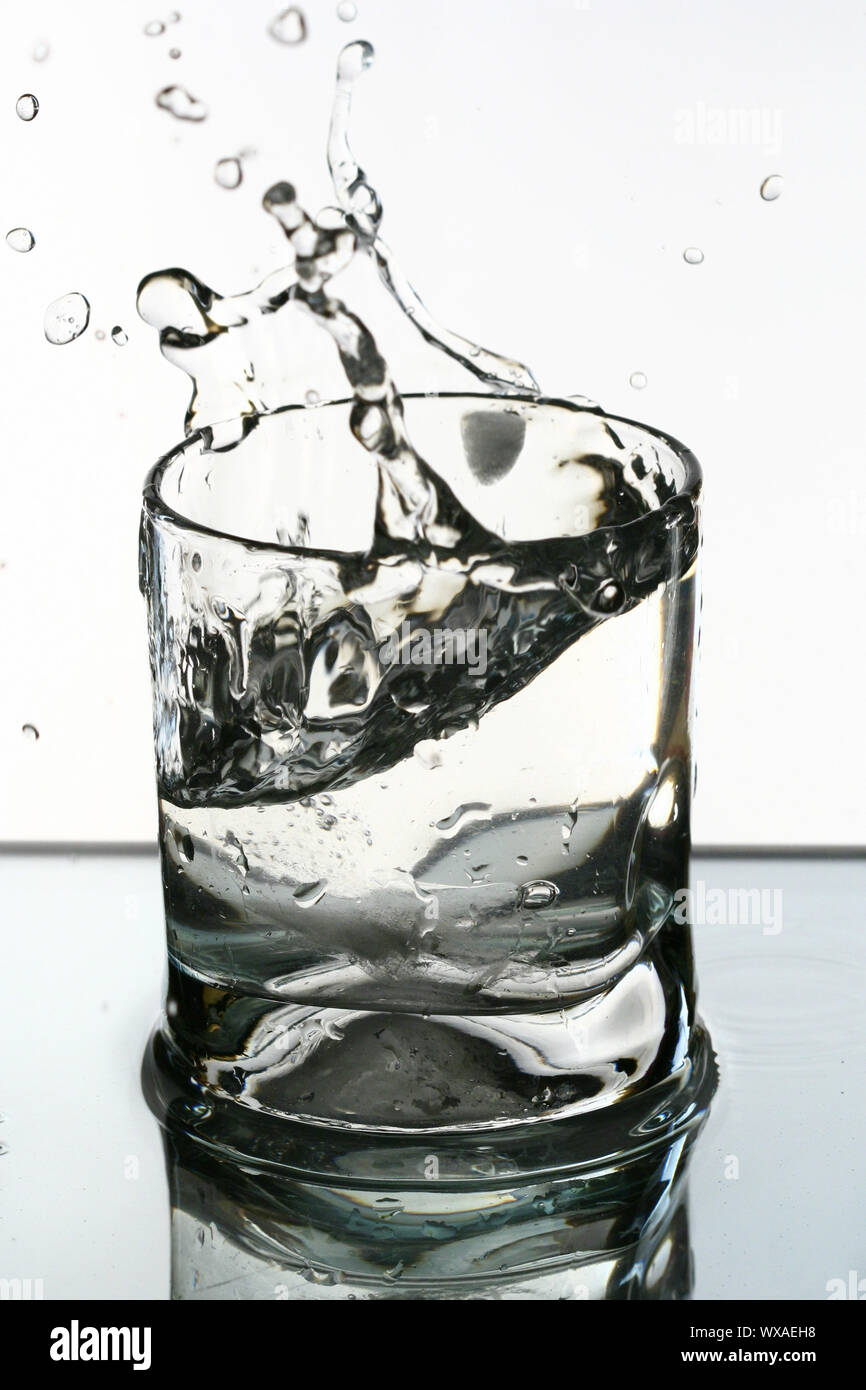 vodka alcohol elegant splash bar background Stock Photo - Alamy