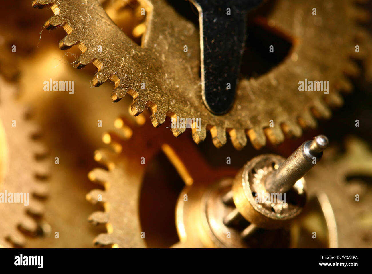 time gear inside my rare clock Stock Photo - Alamy