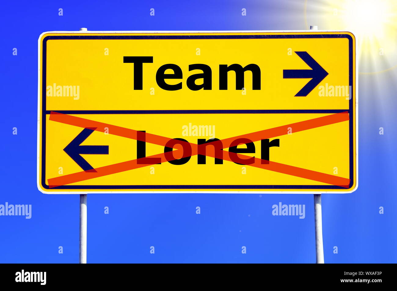 business teamwork concept with yellow road sign Stock Photo - Alamy