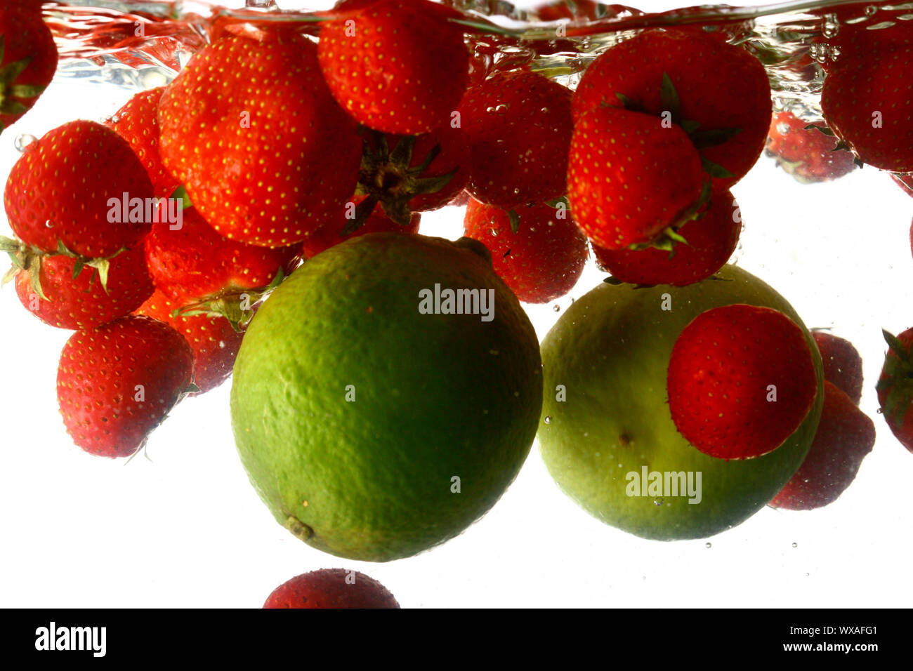 lime splash isolated on white background Stock Photo - Alamy