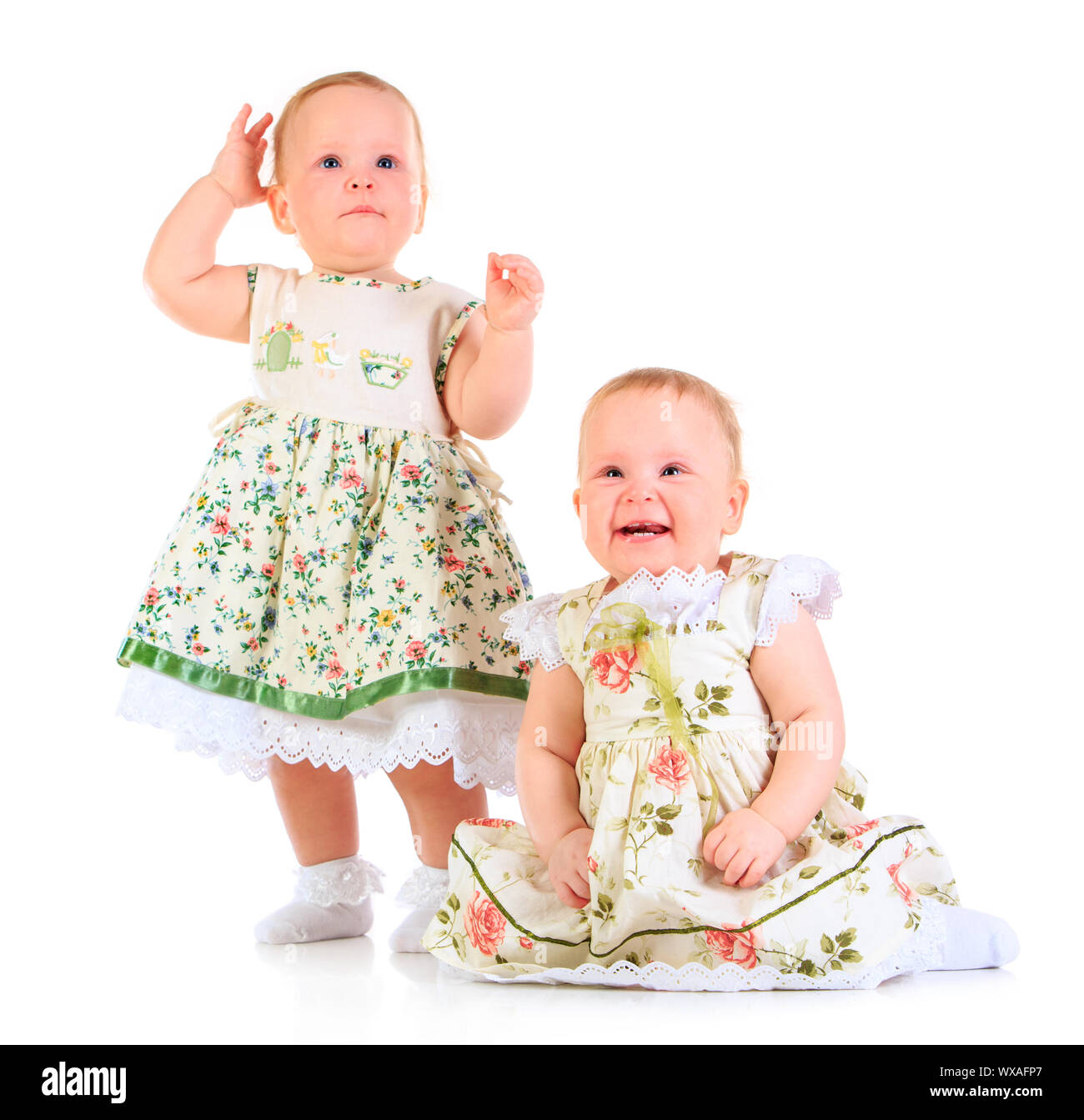 one years old baby girls on a white background Stock Photo - Alamy