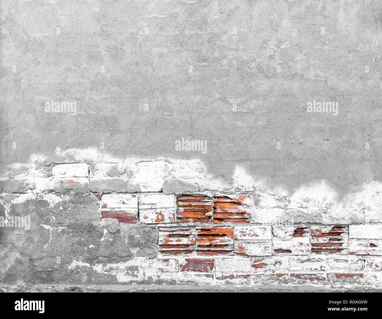 Brick wall with chipped plaster Stock Photo - Alamy